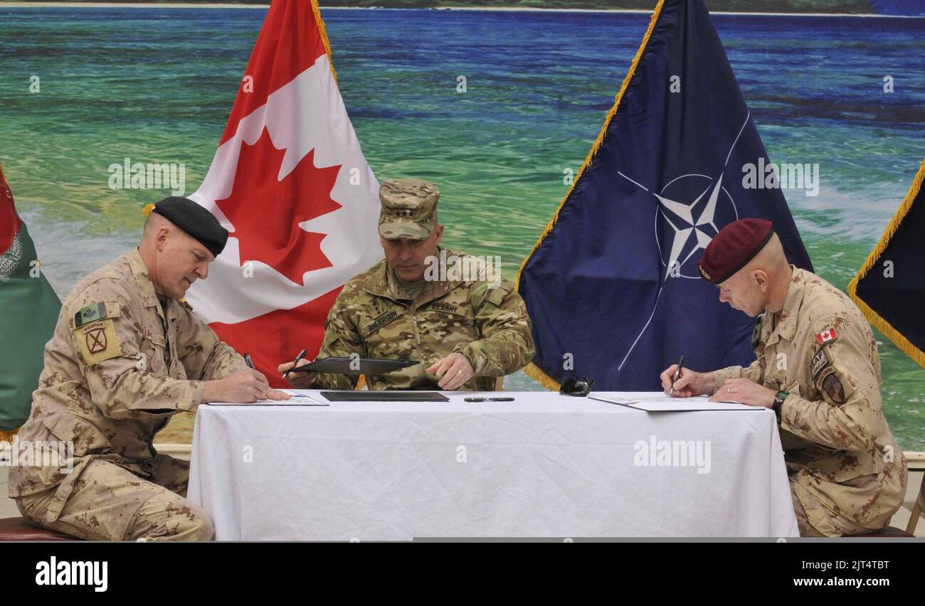 U.S. Army Lt. Gen. Joseph Anderson, center, the commander of the ...