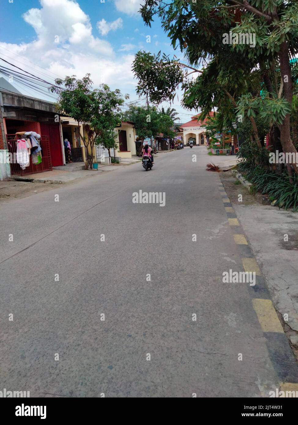 Motorbike rider residential street hi-res stock photography and images ...