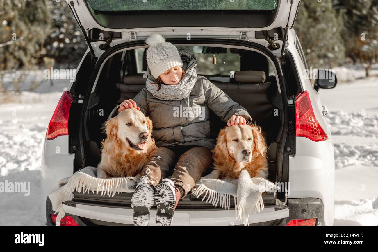Girl petting dog in winter hi-res stock photography and images - Alamy
