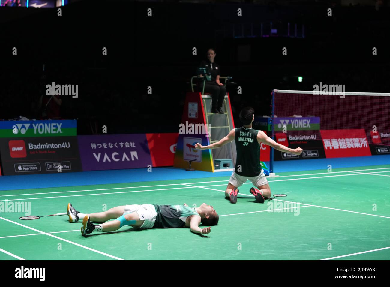 Tokyo, Japan. 28th Aug, 2022. Soh Wooi Yik/Aaron Chia (L) of Malaysia celebrate after winning ...