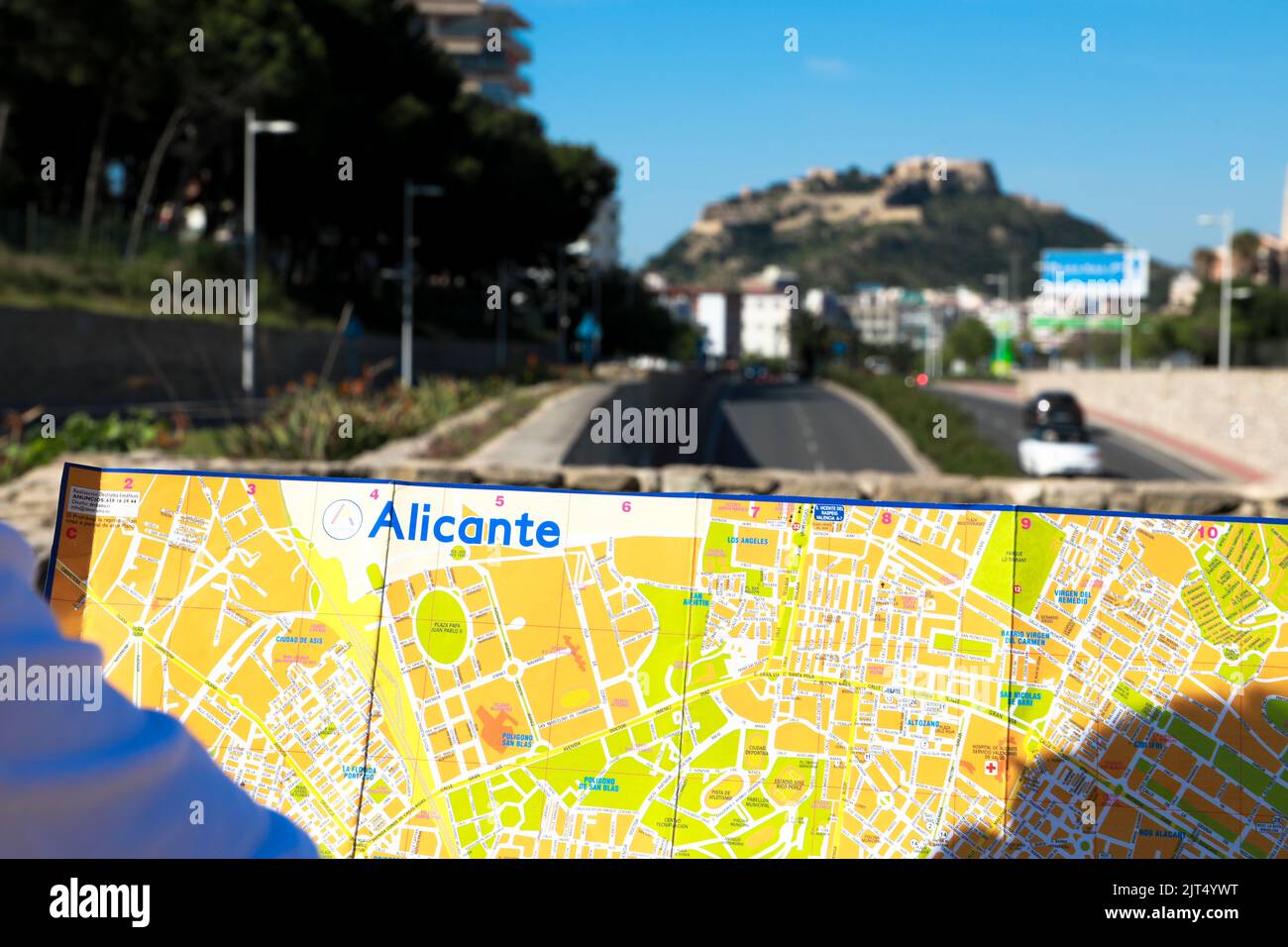 A closeup shot of a tourist holding the map of Alicante, Spain Stock ...