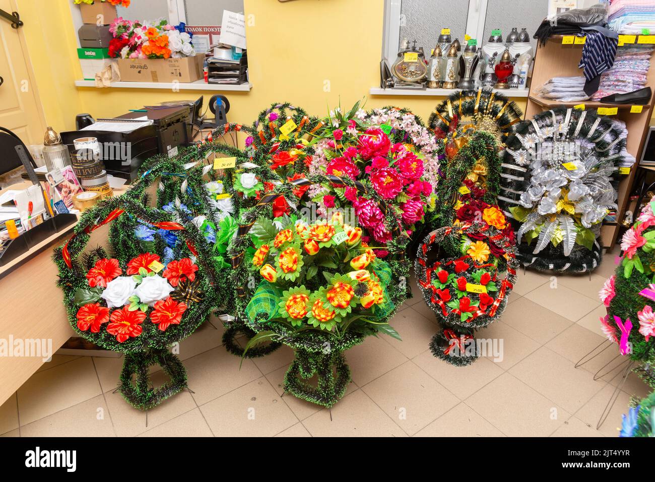 Interior of room with funeral accessories. Shop selling coffins ...