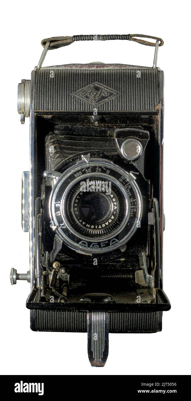 A vertical shot of an old Agfa foldable vintage camera on the white ...