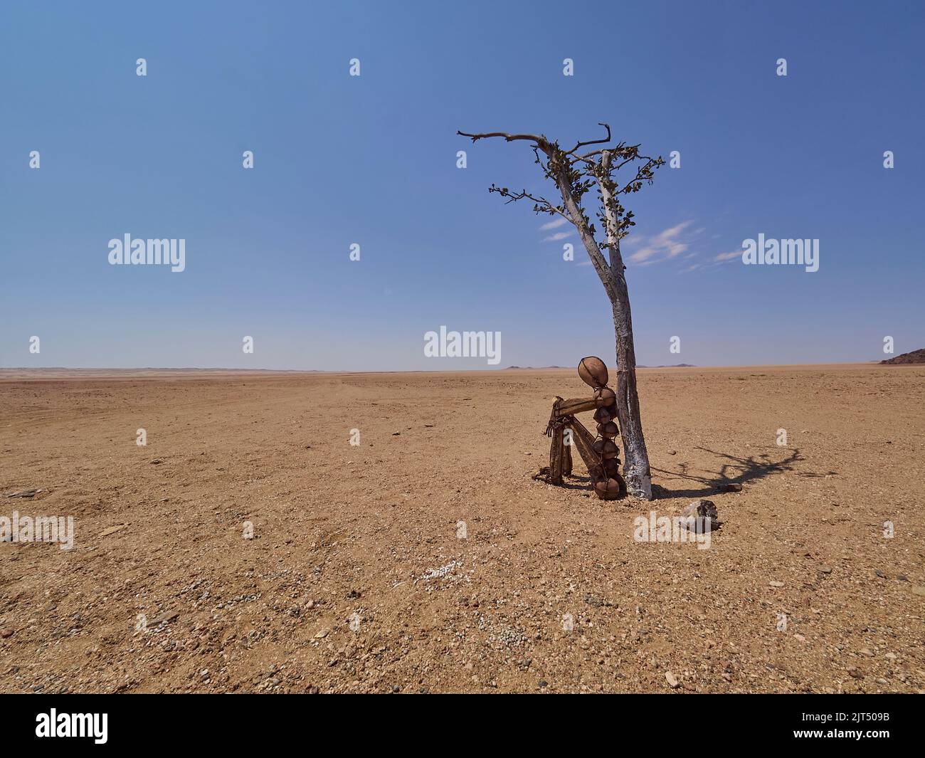 Kaokoveld, Nambia - 11 02 2016: Lone man rock sculpture sitting on the ...