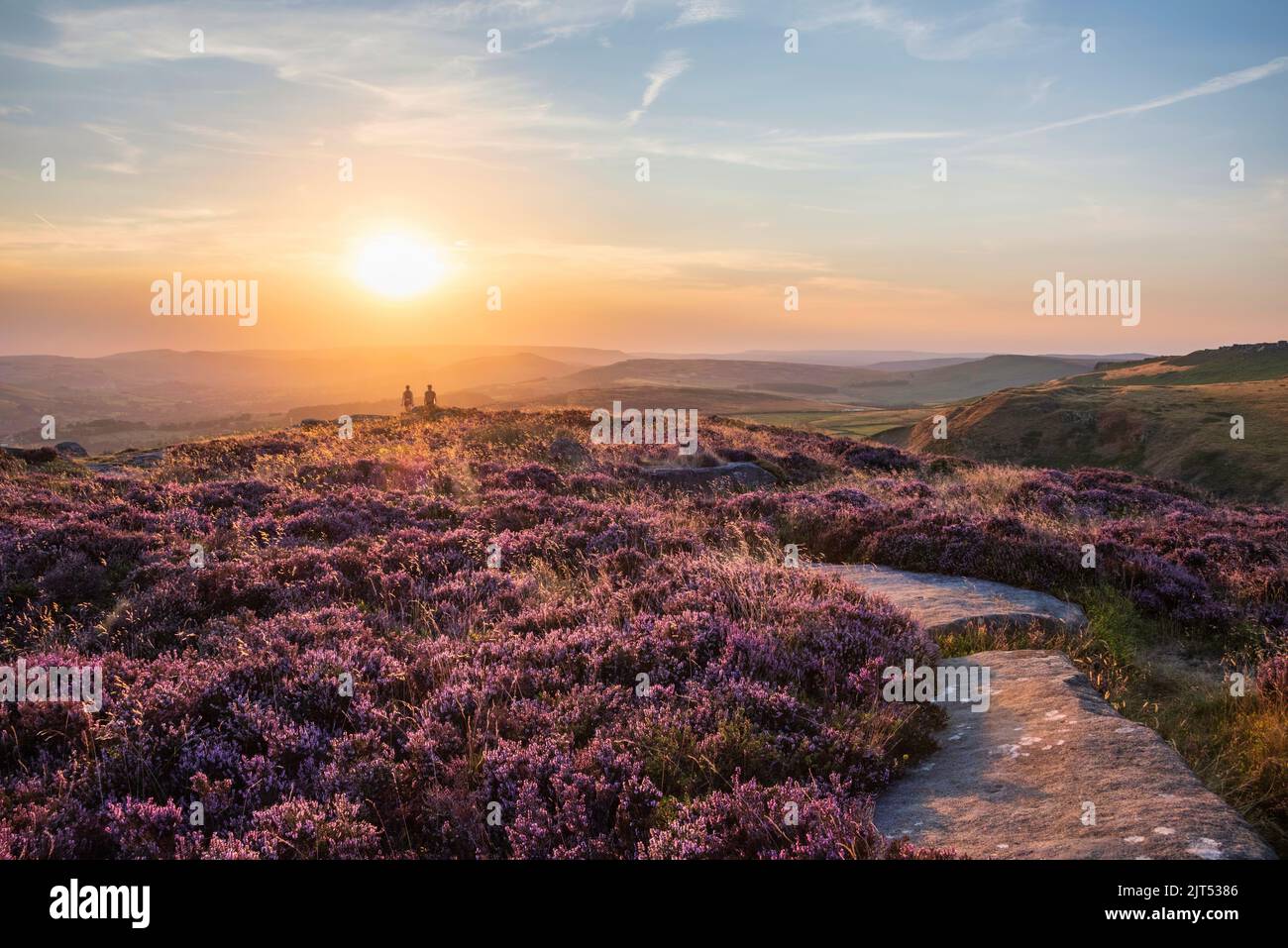 Absolutely stunning sunset landscape image with unidentified couple ...