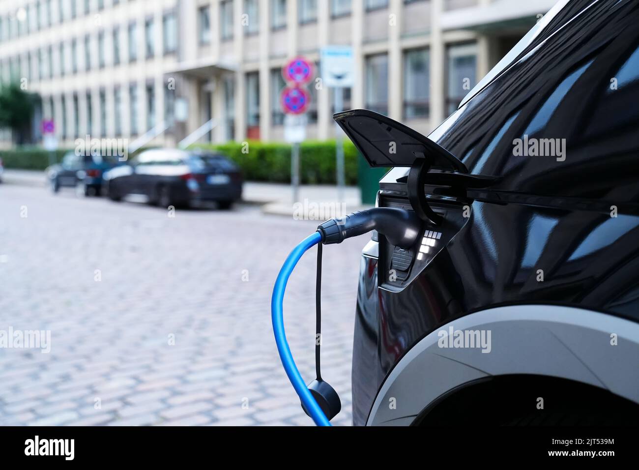 Electromobile charging plug is inserted into vehicle charging socket ...