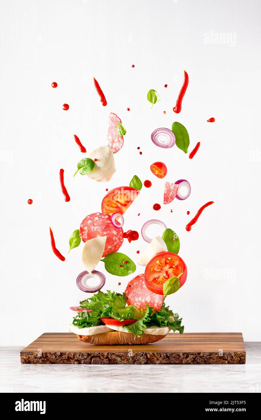 Ingredients of sandwich are falling in the ciabatta. Ciabatta Sandwich ...