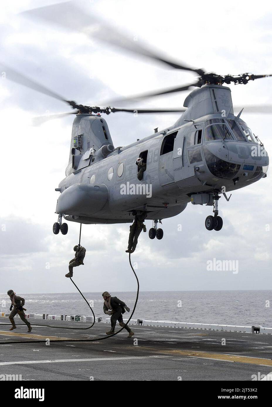 U.S. Marines assigned to the 31st Marine Expedition Unit fast-rope from ...