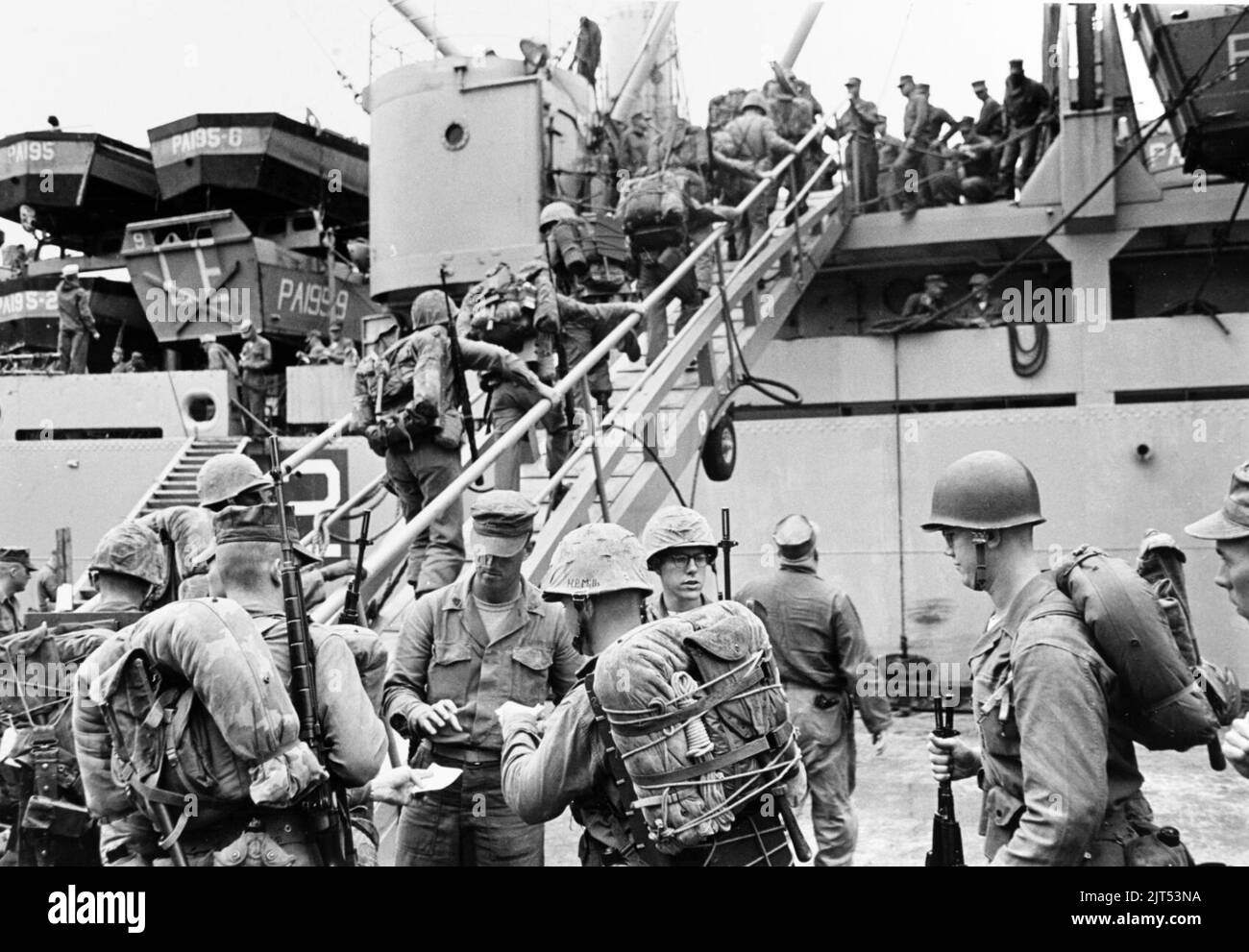 U.S. Marines of the 4th Marine Regiment board USS Lenawee (APA-195) at ...