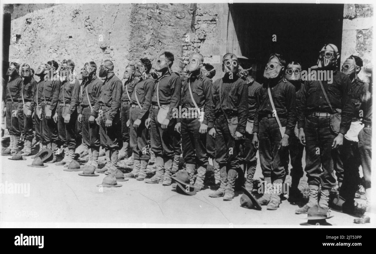 U.S. Marines standing in ranks with gas masks attached; France, 1918 ...