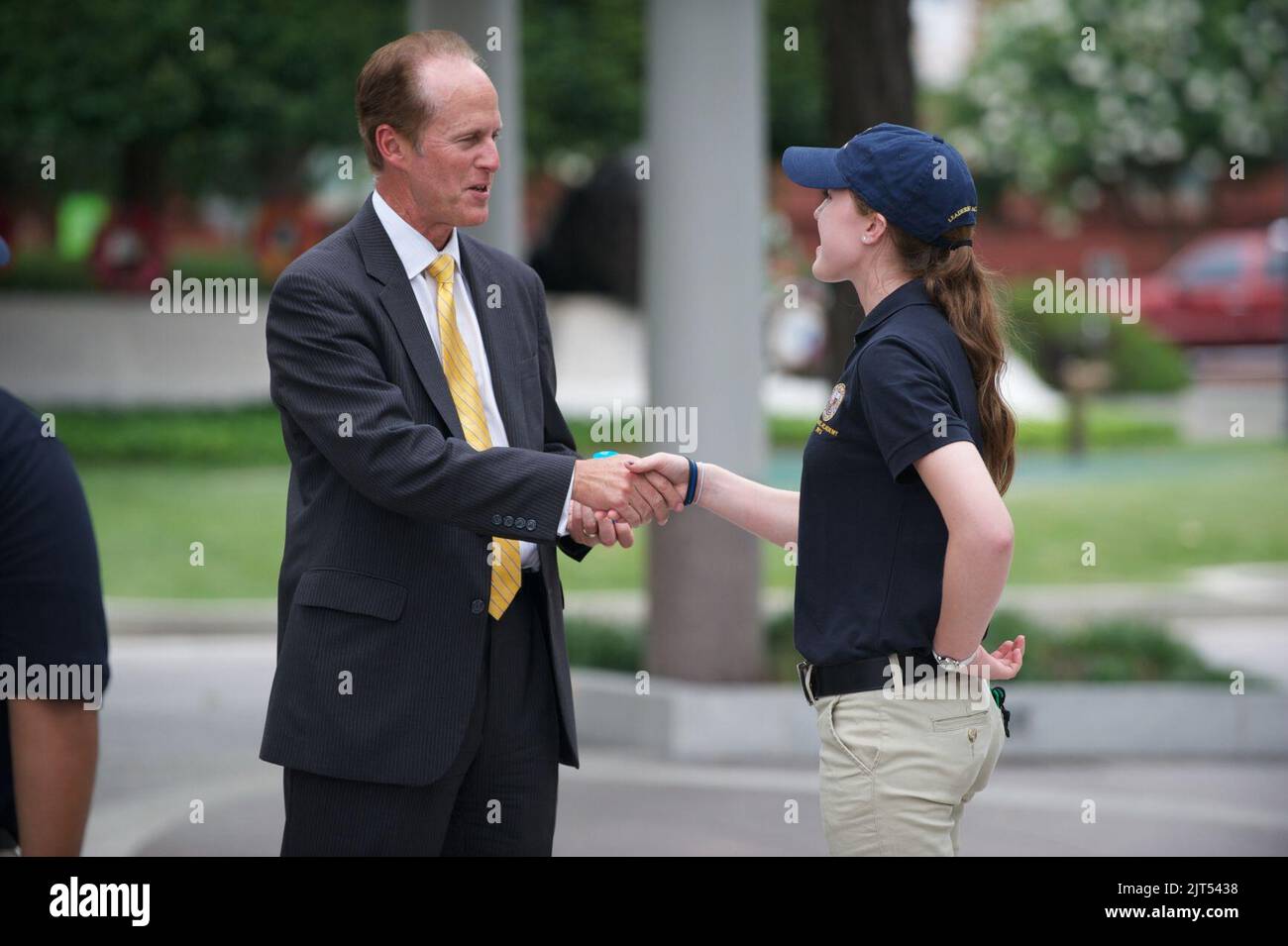 U.S. Marshal shakes hand with Police Explorer Stock Photo - Alamy