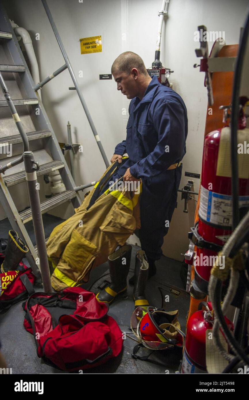 U.S. Naval Academy Midshipman Wesley Frazier dons firefighting ...