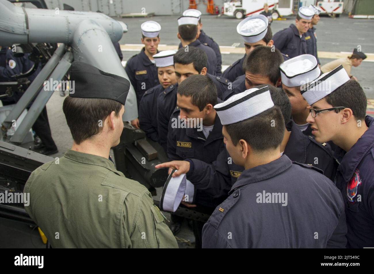 U.S. Naval Aircrewman (Helicopter) 2nd Class left, assigned to ...