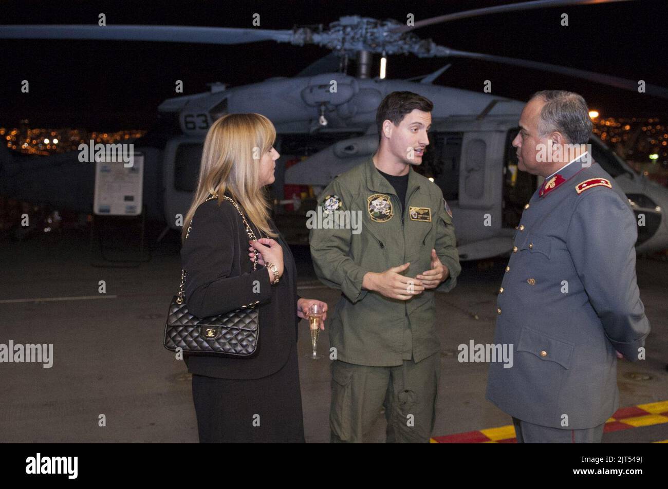 U.S. Naval Aircrewman (Helicopter) 2nd Class center, assigned to ...