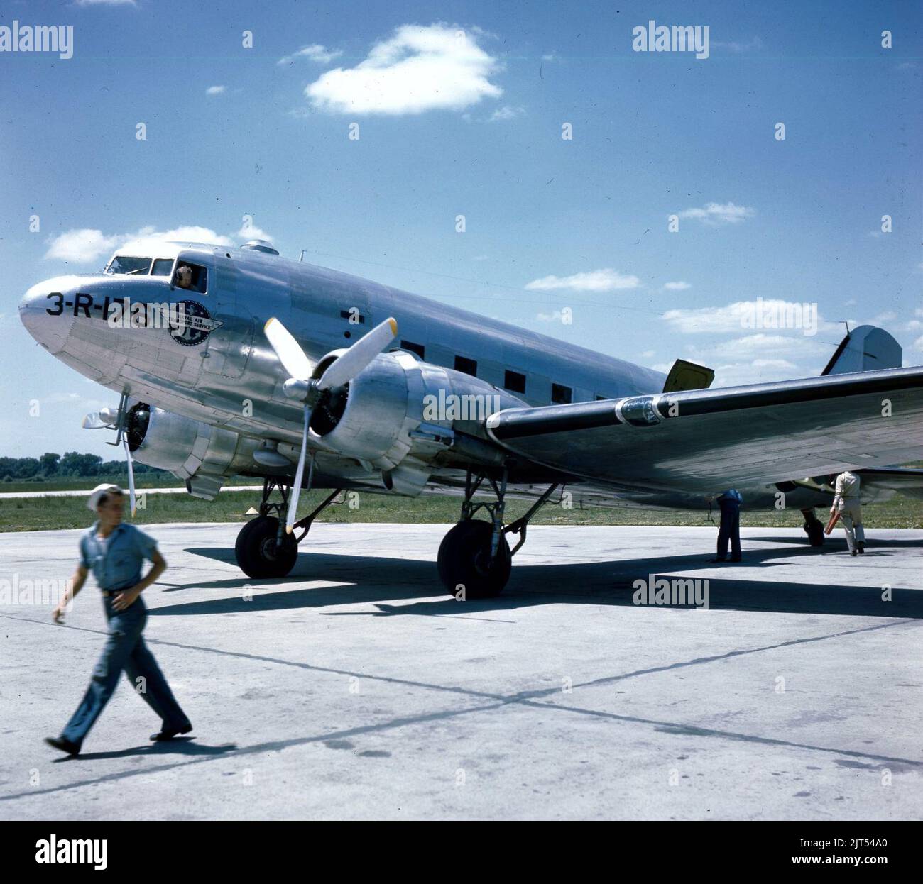 U.S. Naval Air Transport Service Douglas R4D Skytrain of VR-3 unloads ...