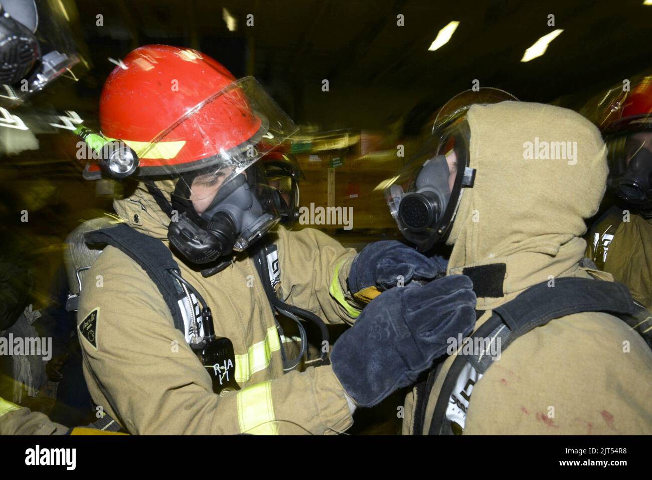 U.S. Navy Aircrew Survival Equipmentman 3rd Class left, helps Damage ...