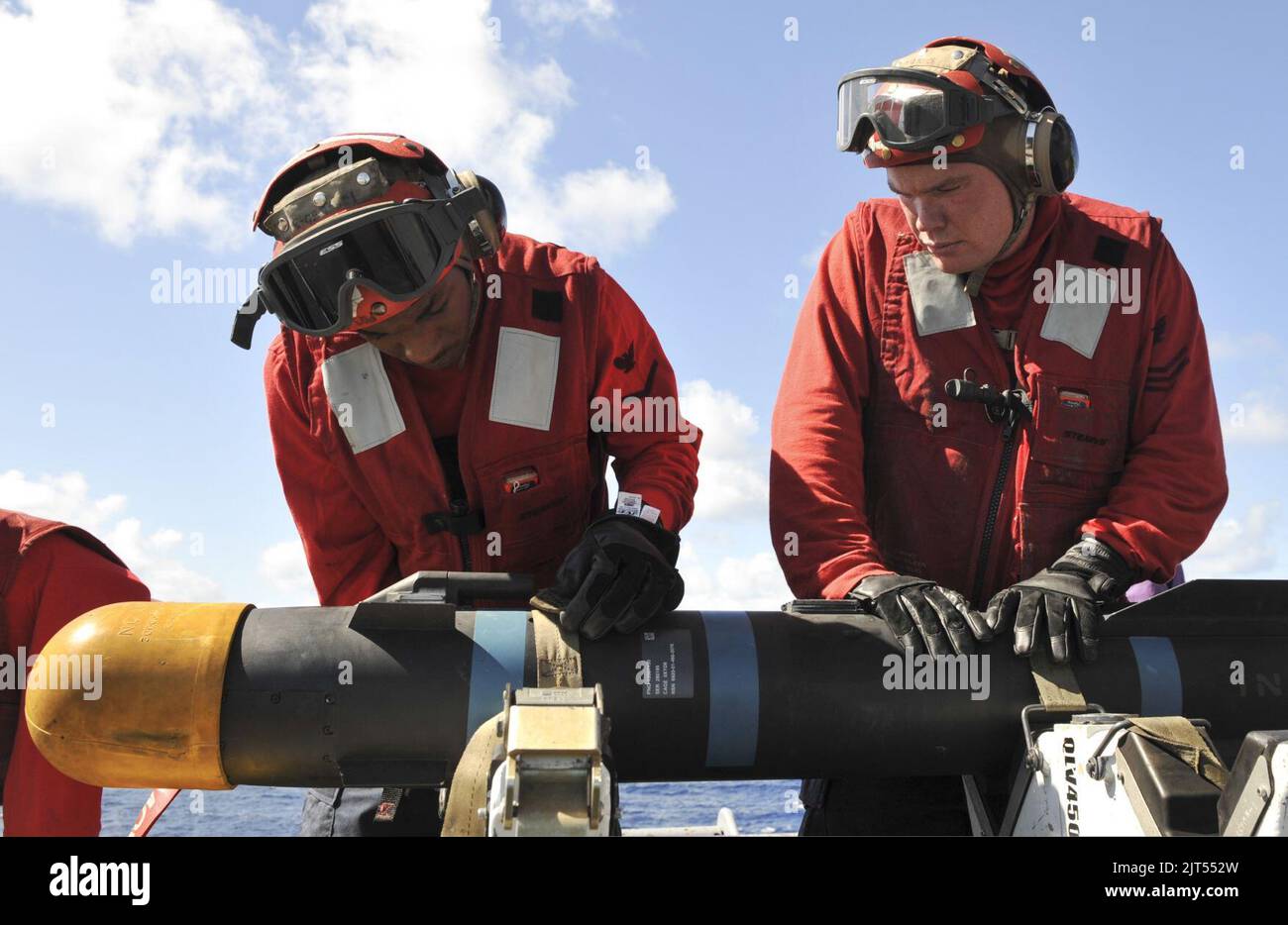 U.S. Navy Aviation Ordnanceman 3rd Class left, and Aviation Ordnanceman ...
