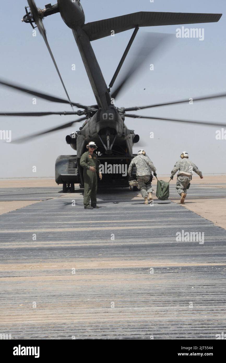 U.S. Navy Aviation Warfare Systems Operator 2nd Class left, directs ...