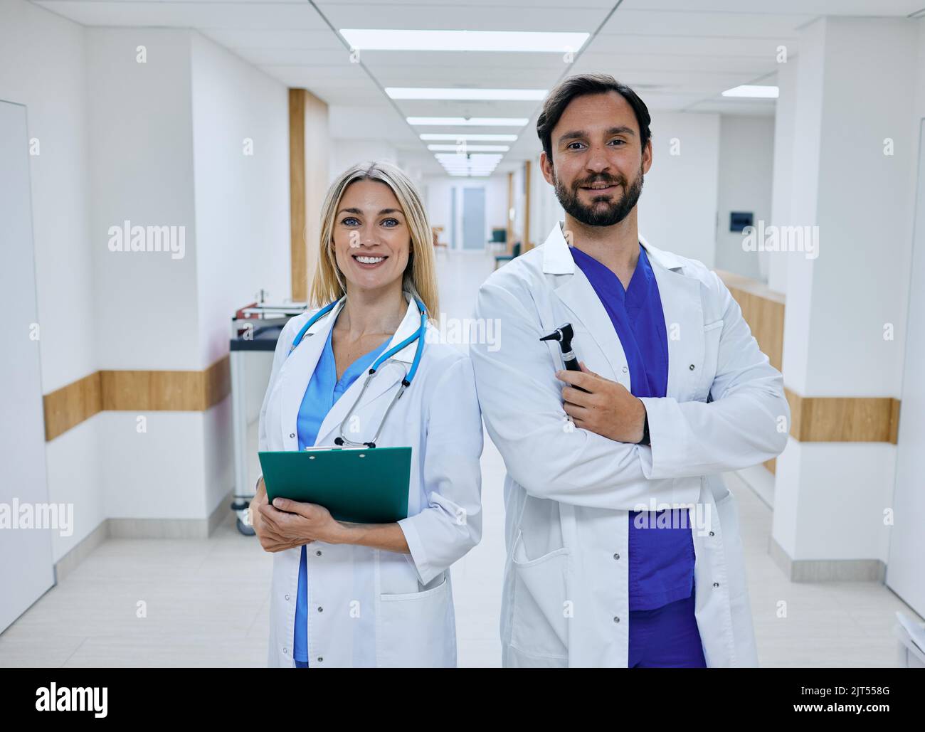 medical teamwork. Portrait of happy medical team standing in hospital corridor after hard ...