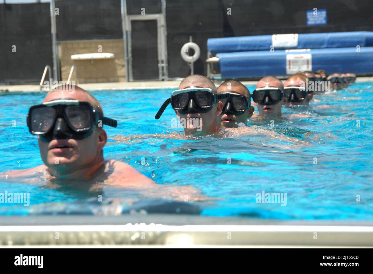U.S. Navy Basic Crewman Training candidates tread water in a pool while ...