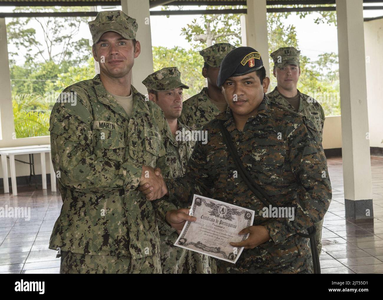 U.S. Navy Boatswain's Mate 3rd Class , left, attached to Coastal ...