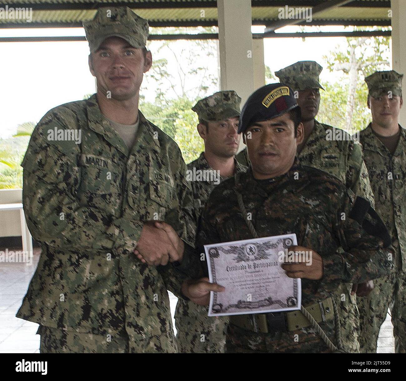 U.S. Navy Boatswain's Mate 3rd Class , left, attached to Coastal ...