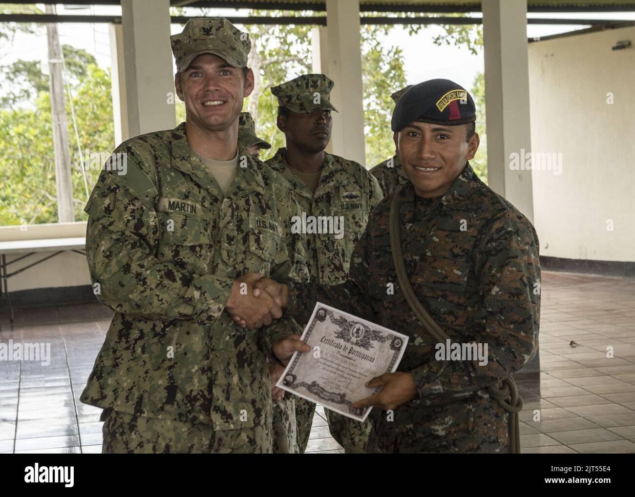 U.S. Navy Boatswain's Mate 3rd Class , left, attached to Coastal ...