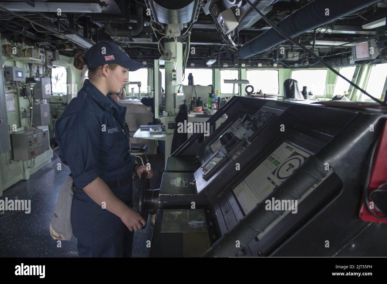 U.S. Navy Boatswain's Mate Seaman Recruit steers the ship while ...