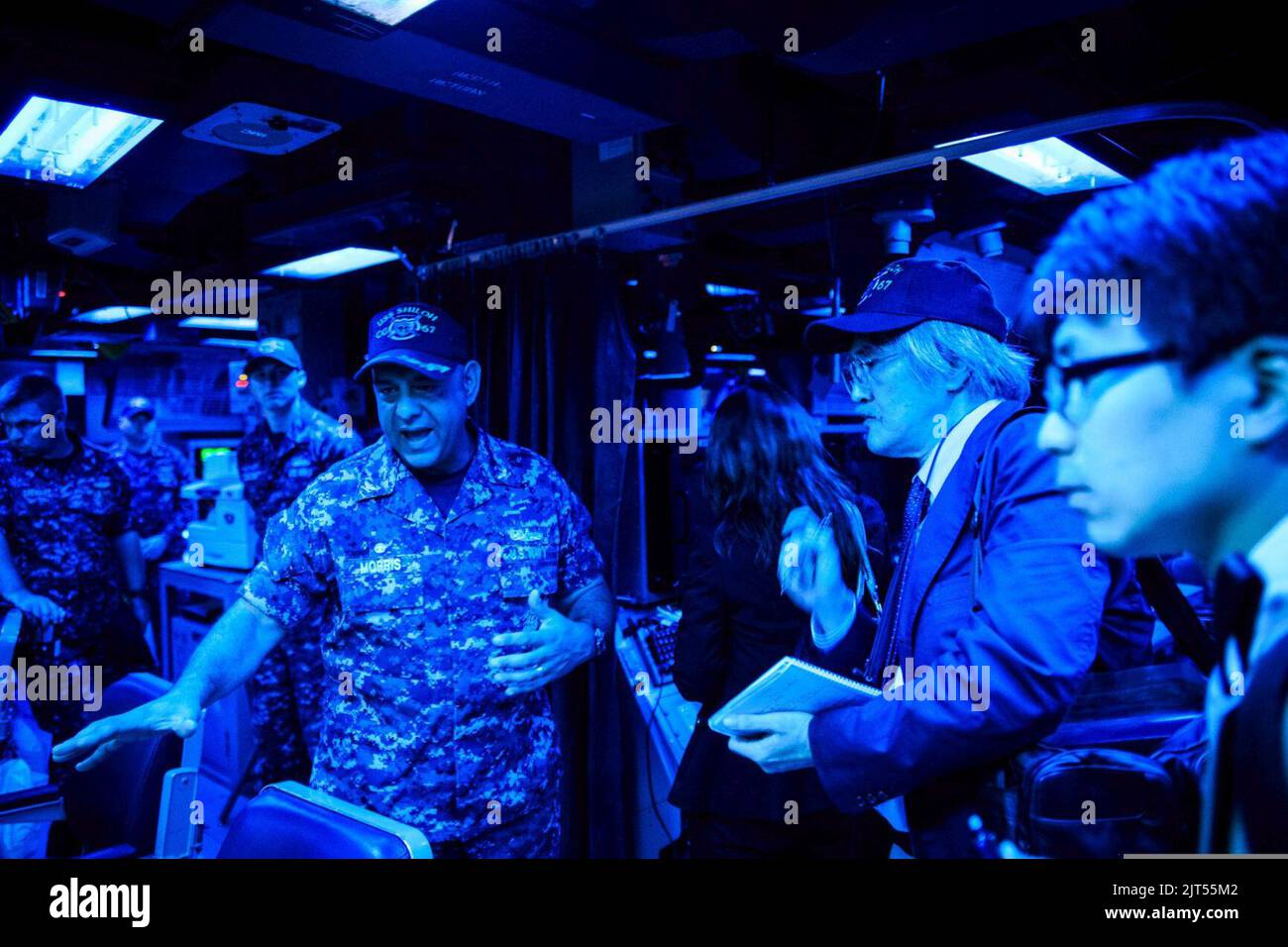 U.S. Navy Capt. right, the commanding officer of the guided-missile ...