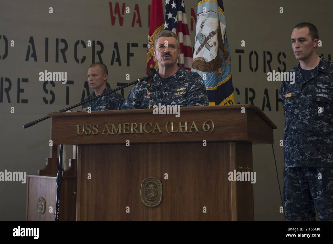 U.S. Navy Capt. center, the commanding officer of the newly commissioned amphibious assault ship ...