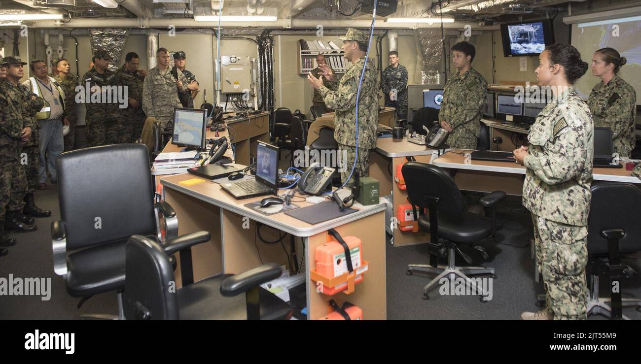 U.S. Navy Capt. center right, the mission commander for Southern ...