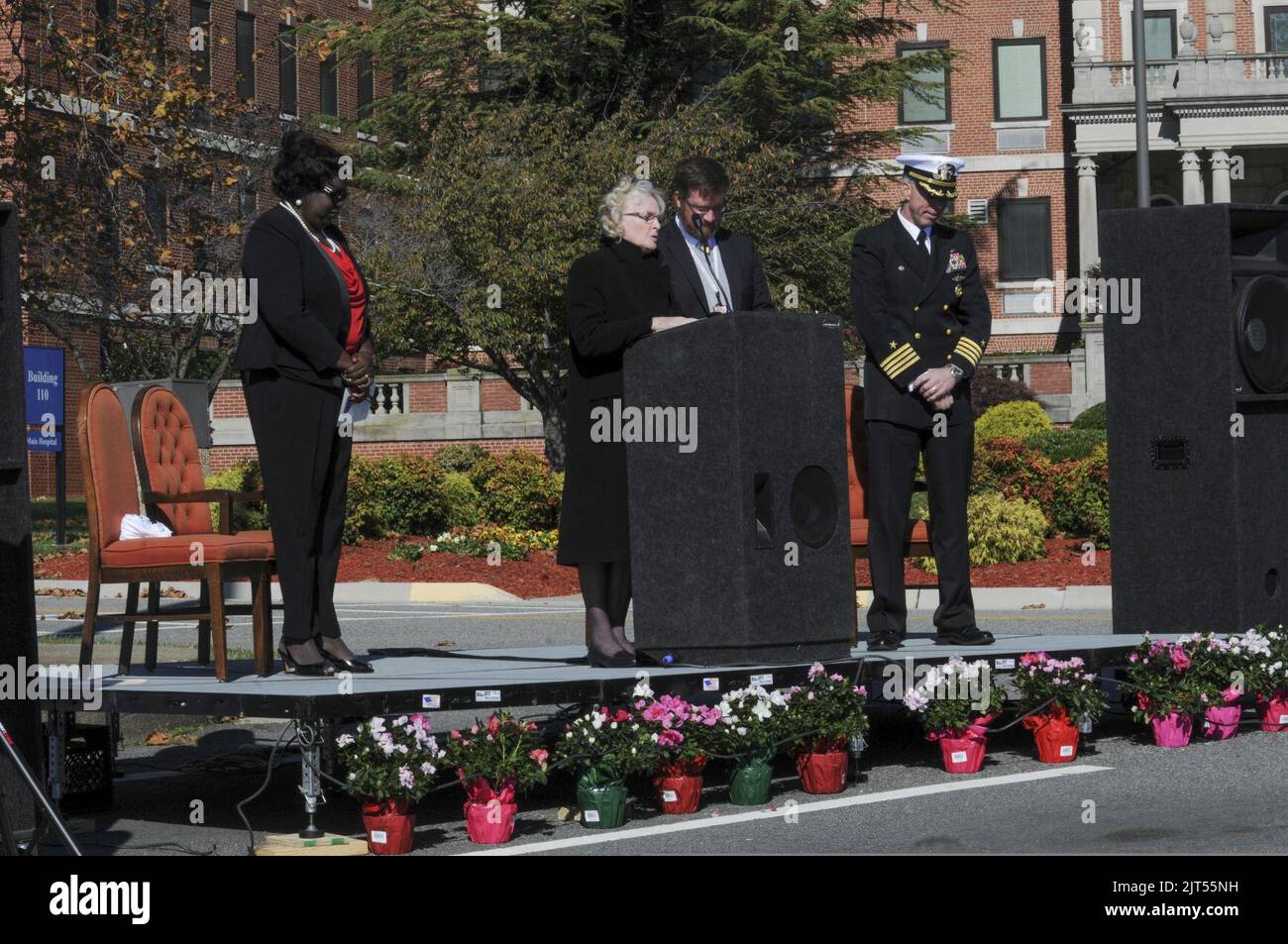 U.S. Navy Capt. right, the commanding officer of the aircraft carrier ...