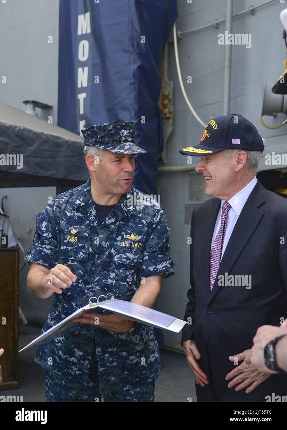 U.S. Navy Capt. left, the commanding officer of the guided missile ...