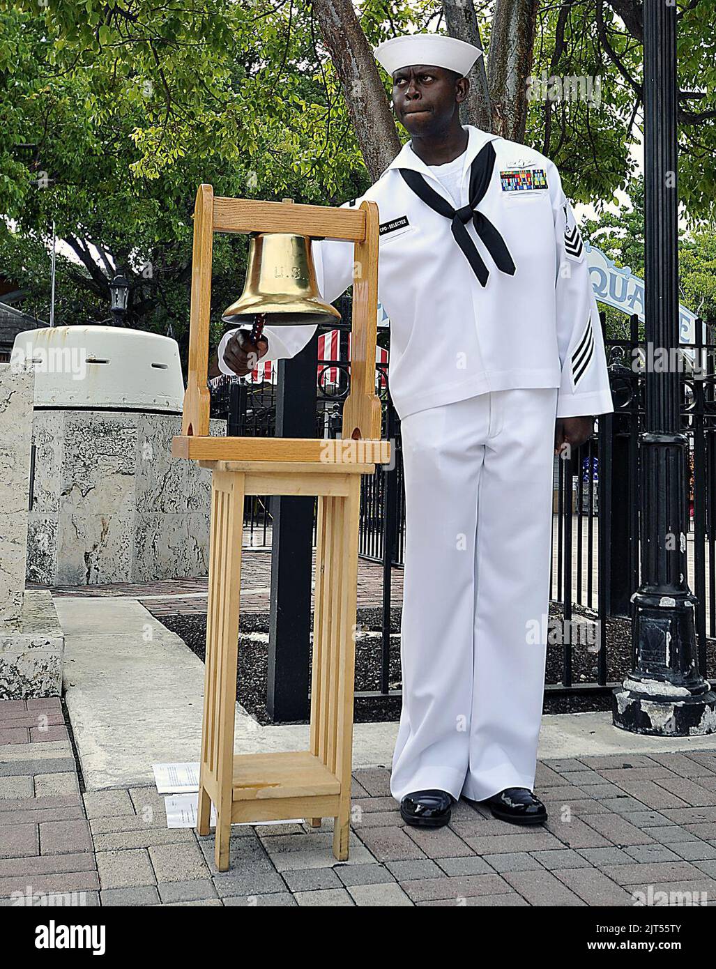 U.S. Navy Chief (Select) Operations Specialist Oliver Williams rings ...