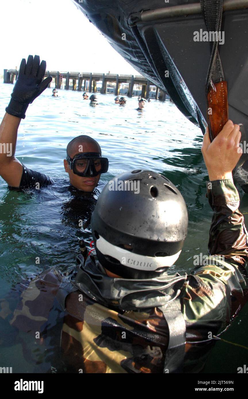 U.S. Navy Chief Special Boat Operator left, a Basic Crewman Training ...