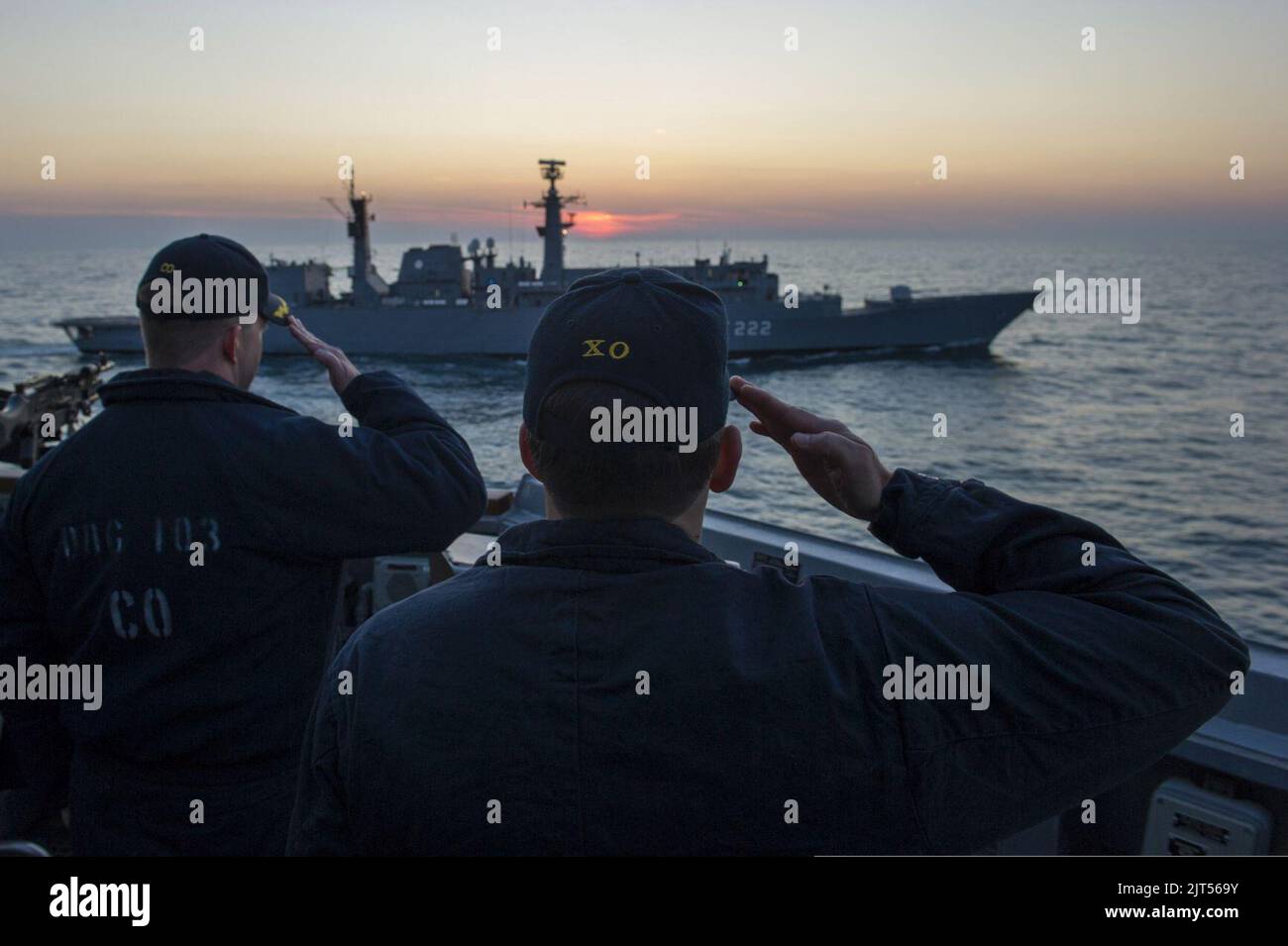 U.S. Navy Cmdr. Andrew Biehn, right, the commanding officer of the ...