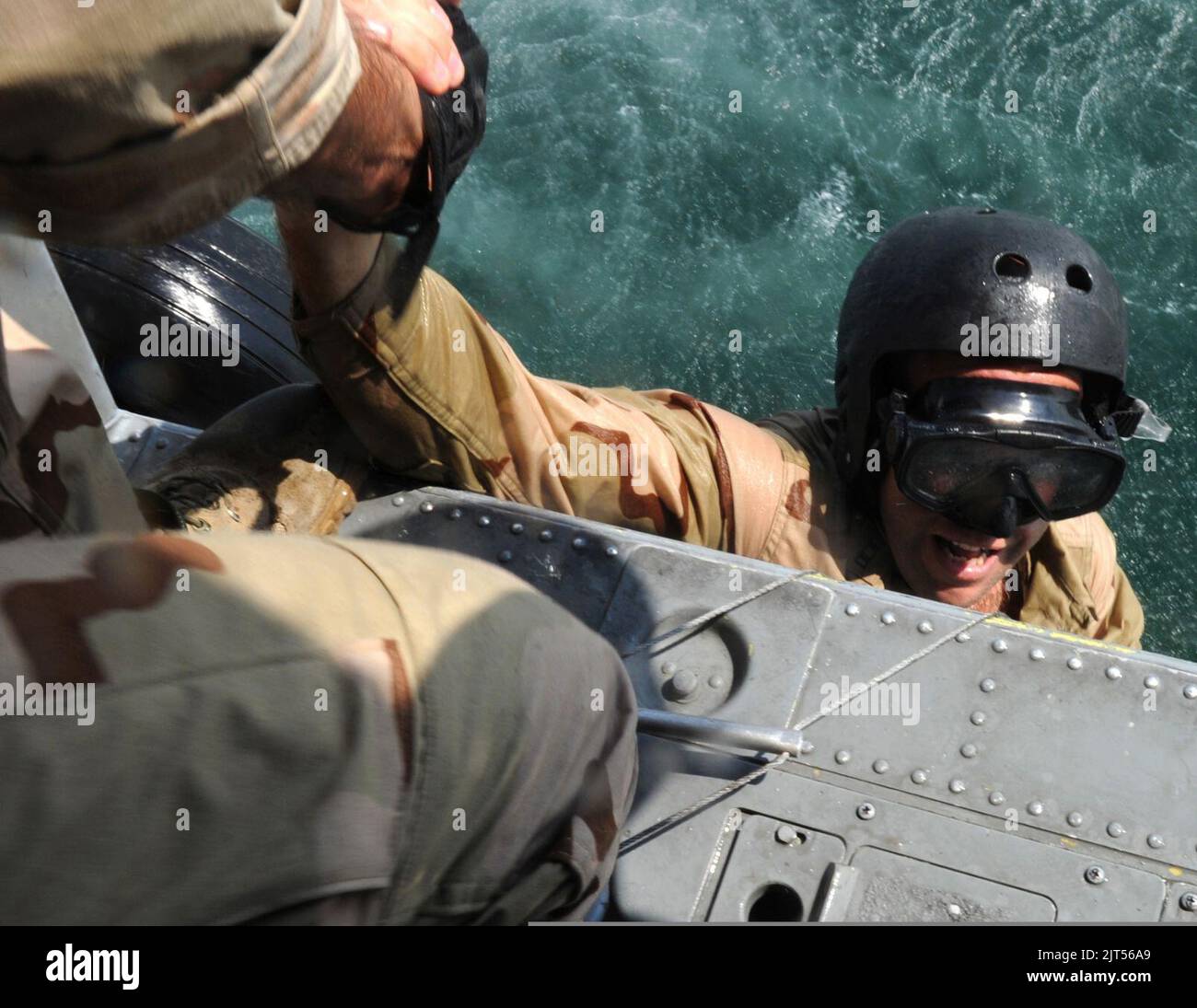 U.S. Navy Chief Warrant Officer right, assigned to Mobile Diving and ...