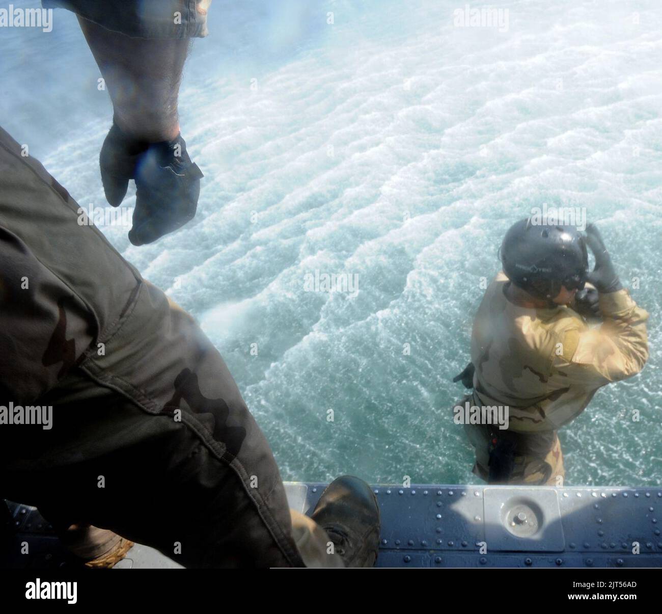 U.S. Navy Chief Warrant Officer right, assigned to Mobile Diving and ...