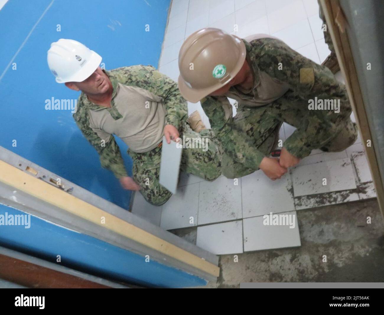 U.S. Navy Chief Steelworker left, teaches Builder Constructionman both ...