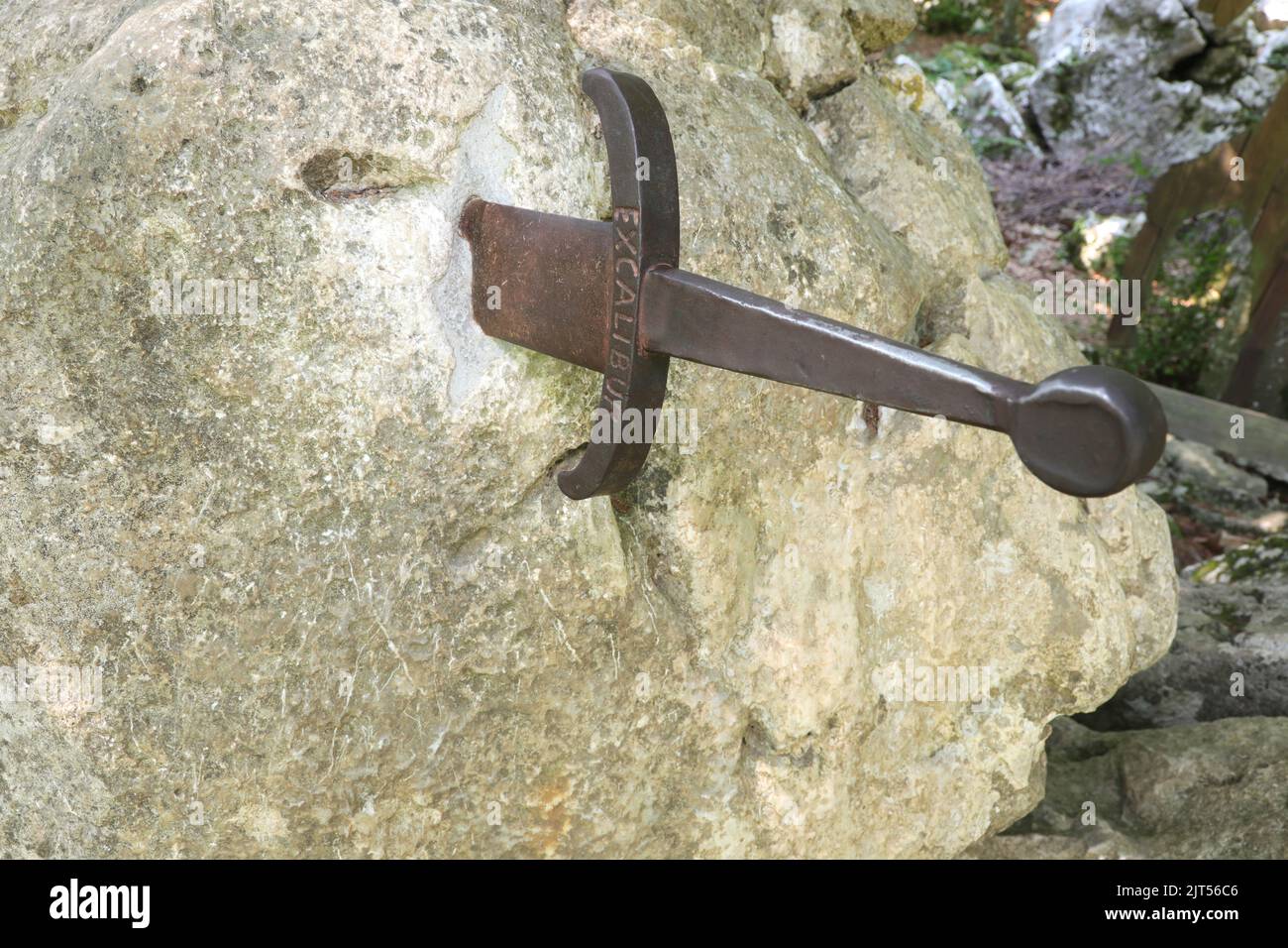 sword with the word Excalibur stuck on the rock as in the legend of ...