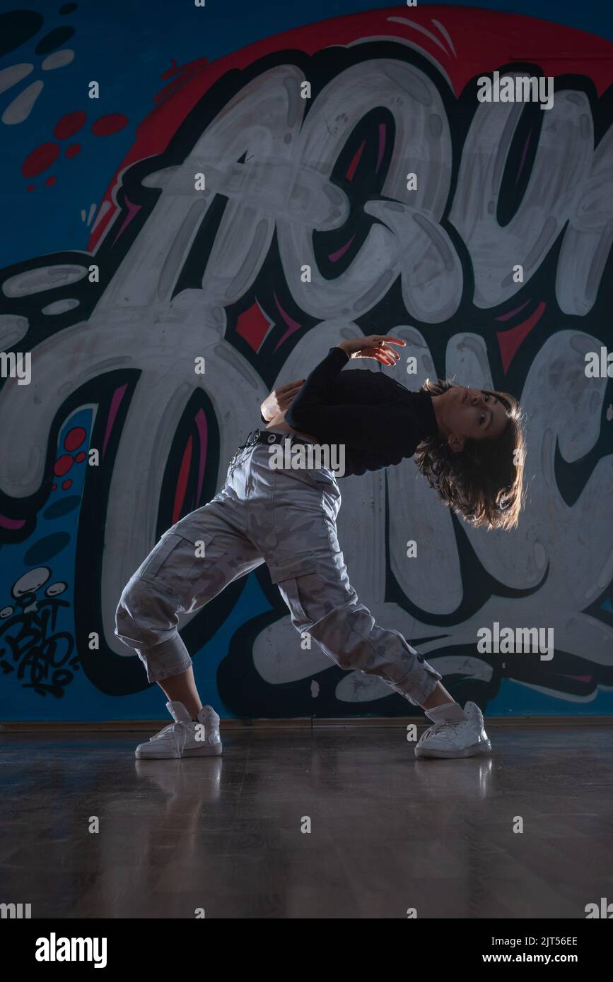 Silhouette of young woman hiphop dancer (breakdancer)dancing on ...