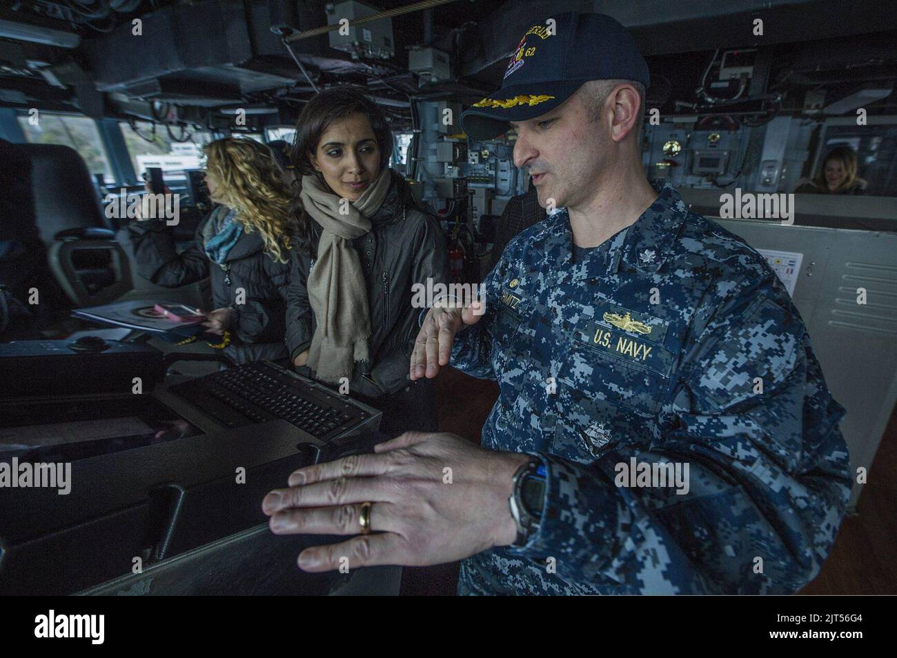 U.S. Navy Cmdr. Jonathan Schmitz, right, the commanding officer of the ...