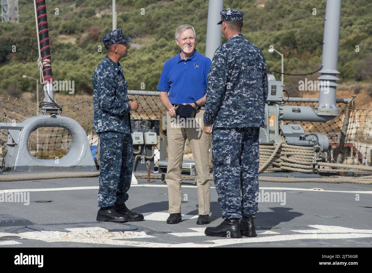 U.S. Navy Cmdr. Dave Stoner, left, the commanding officer of the guided ...