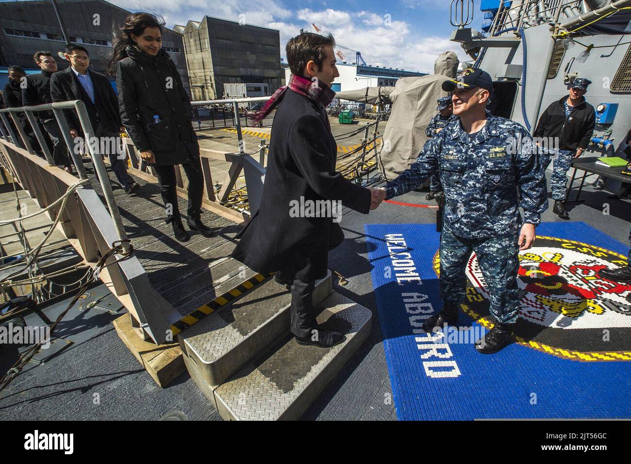 U.S. Navy Cmdr. Jonathan Schmitz, right, the commanding officer of the ...