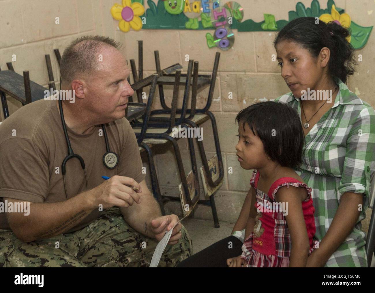 U.S. Navy Cmdr. Michael Cackovic, left, a medical officer attached to ...