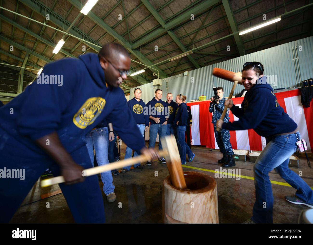 U.S. Navy Construction Electrician 2nd Class right, assigned to Naval ...
