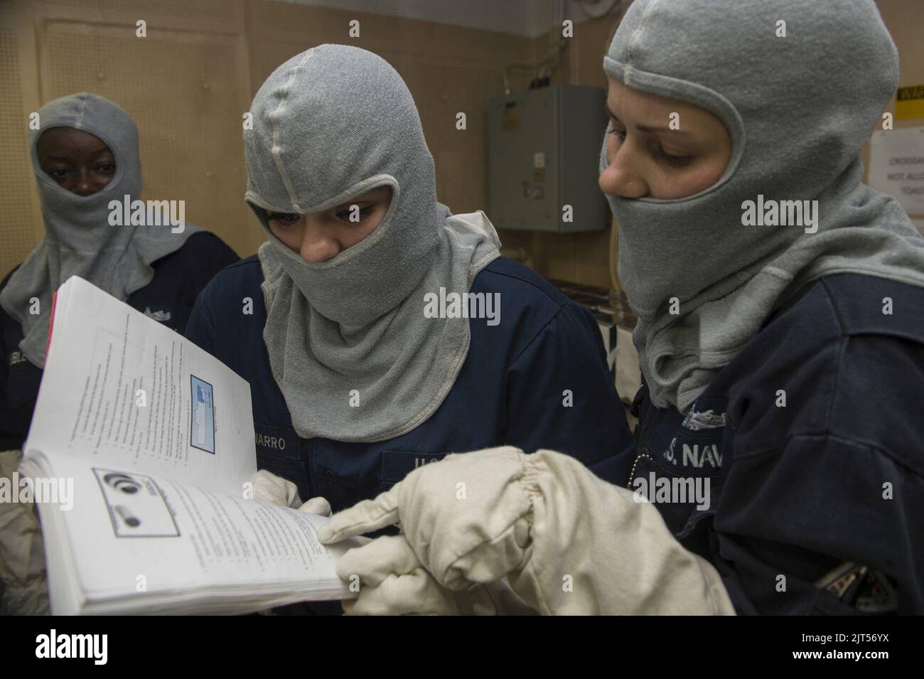 U.S. Navy Damage Controlman 1st Class right, provides training to ...