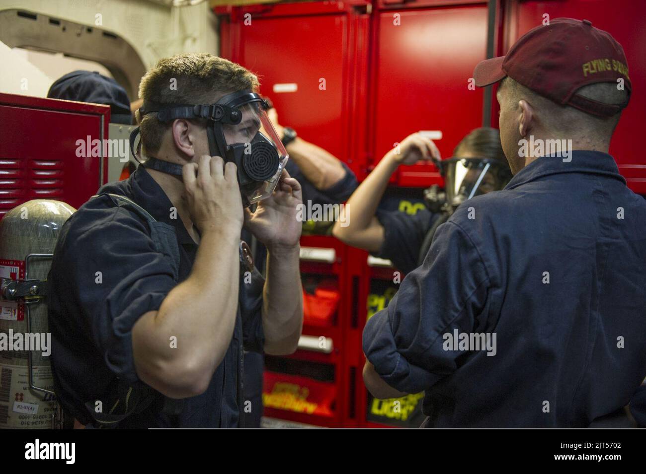 U.S. Navy Damage Controlman 3rd Class right, instructs U.S. Naval ...