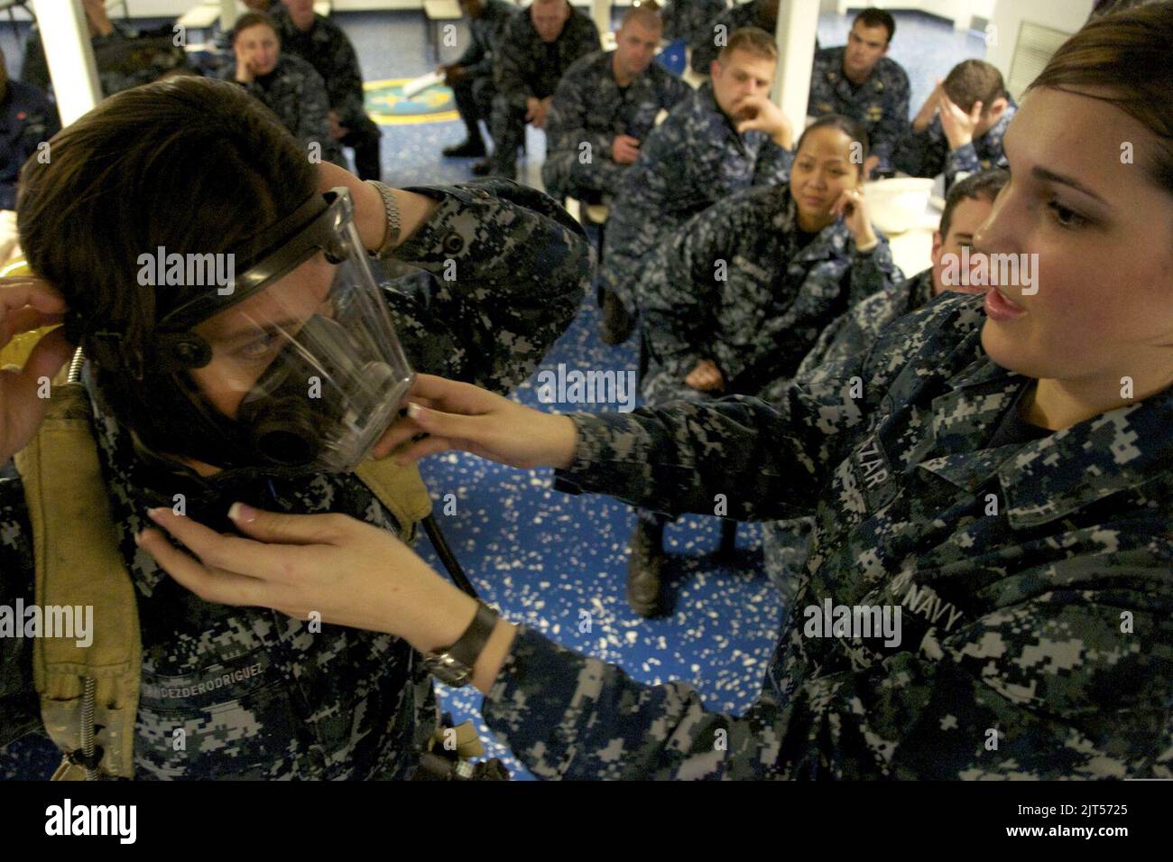 U.S. Navy Damage Controlman Fireman Apprentice right, serving with ...