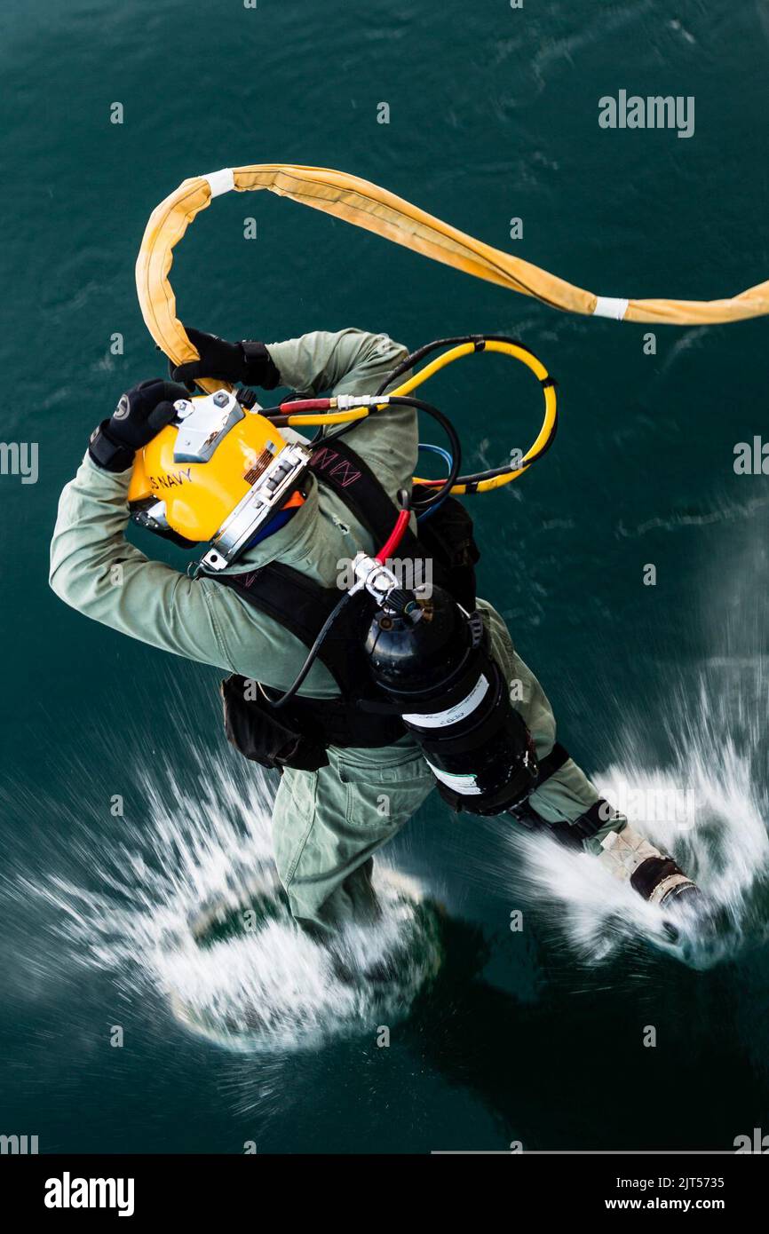 U.S. Navy Diver enters the water during a training evolution at the ...